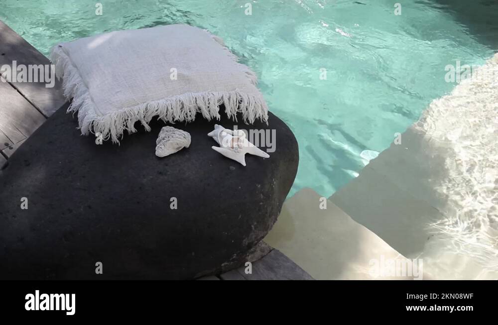 Girl in white bikini stepping into water to swim Stock Video Footage ...