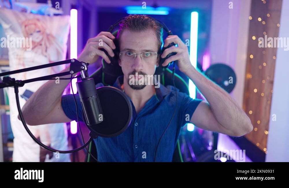 Confident male gamer put on glasses with middle finger and get ready to ...