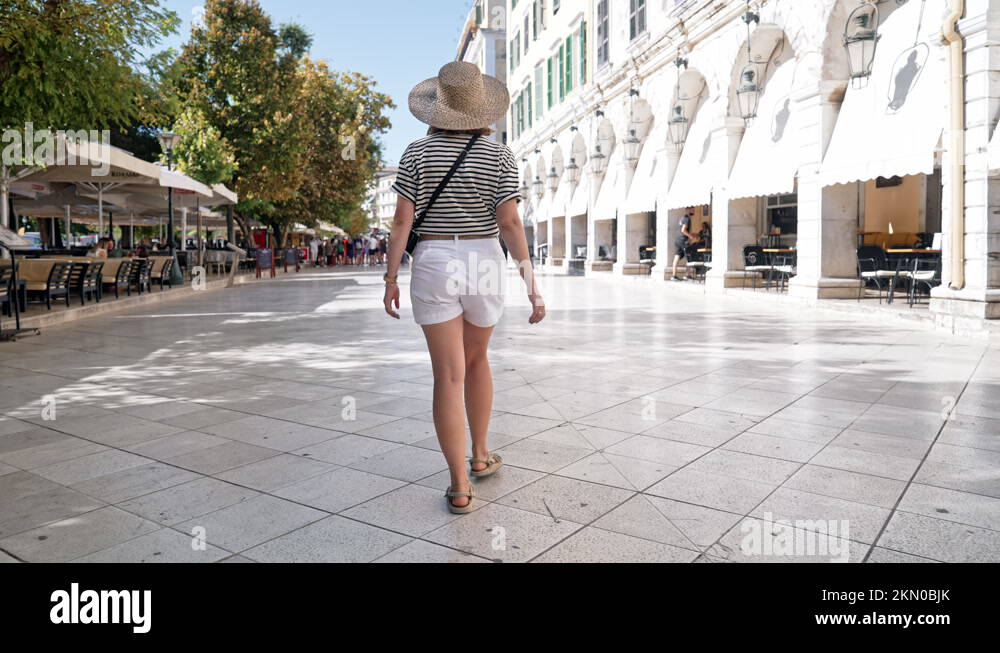 Corfu, Greece - September, 2021. Woman walking alone on Liston Street ...