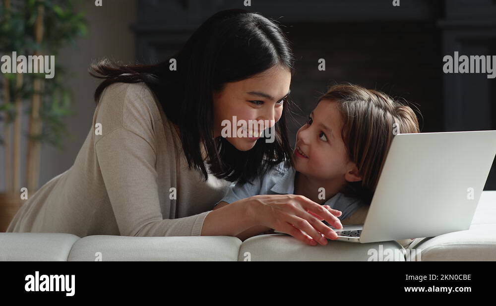 Caring Young Korean Asian Mom Teaching Son Using Computer Stock Video