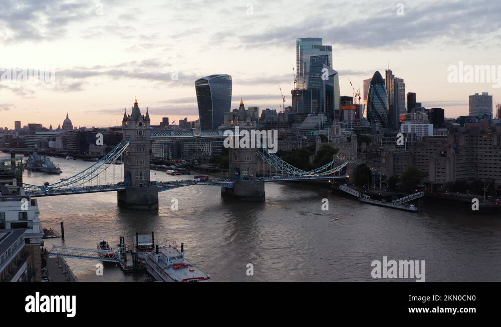 Cars and red double decker driving through historic Tower Bridge across ...