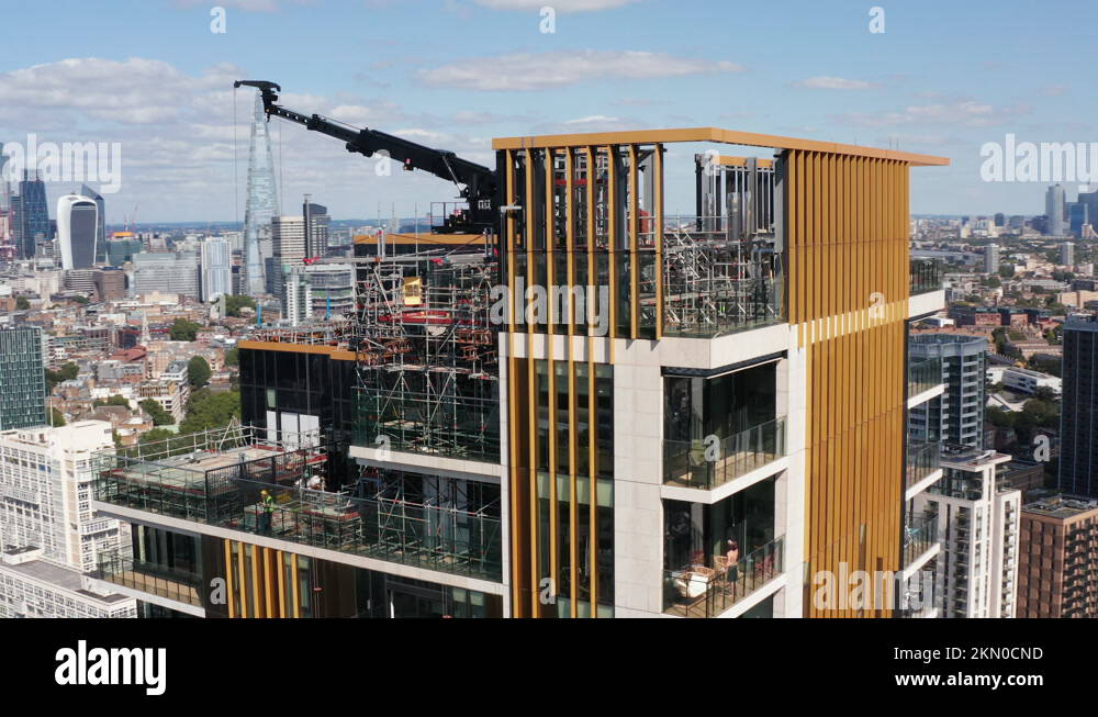 Fly around top of One The Elephant apartment building. Scaffolding and ...