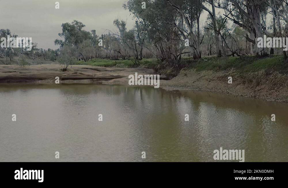 Forward drone shot above a water basin in the dry australian outback ...