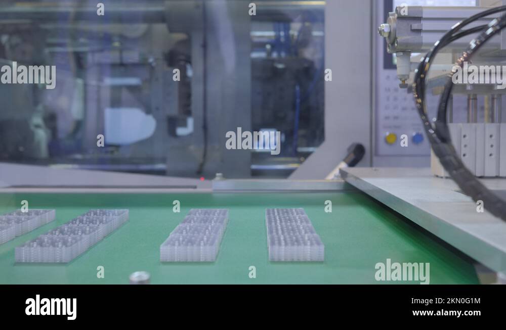 Pick and place robotic arm manipulator moving plastic detail on ...