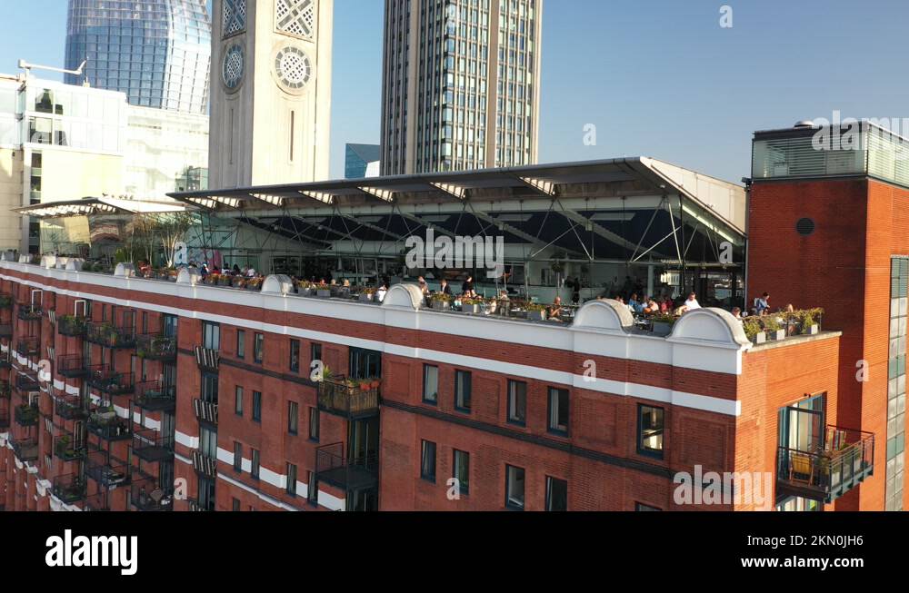 Brick building on waterfront with roofed restaurant terrace Stock Video ...