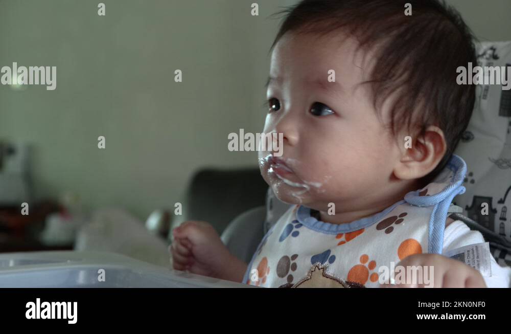 7 month old Cute Little Asian Chinese Baby Eating His Dinner. 4k. Child ...