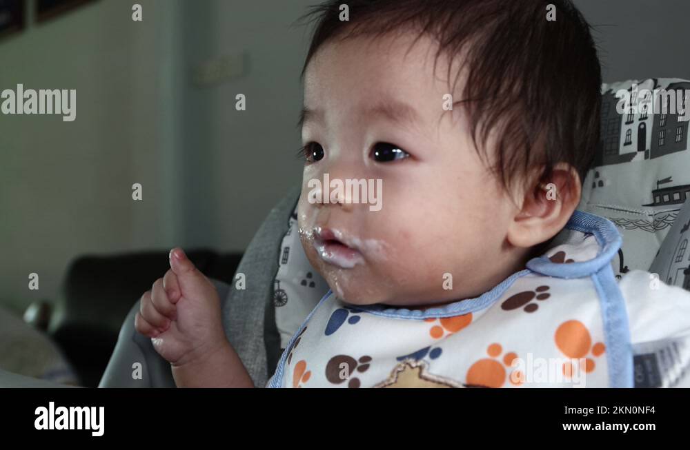 7 month old Cute Little Asian Chinese Baby Eating His Dinner. 4k. Child ...