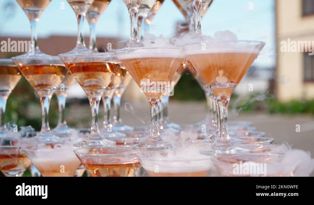 Beautiful pyramid of champagne at celebration. Alcoholic drinks at ...