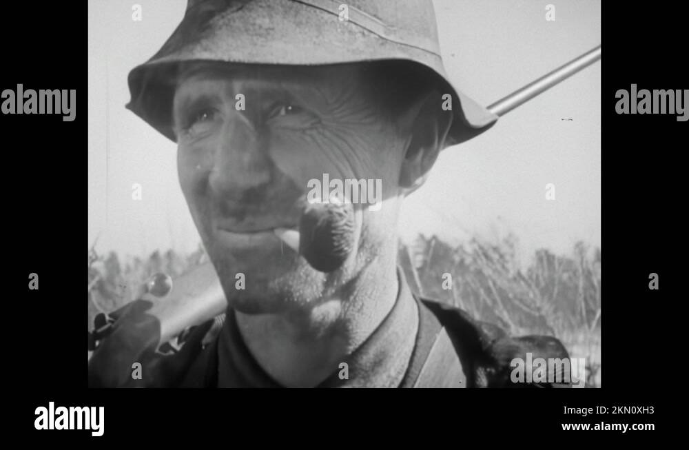 1940s: Cemetery headstone. Man with gun smoking pipe. Smiling faces of ...