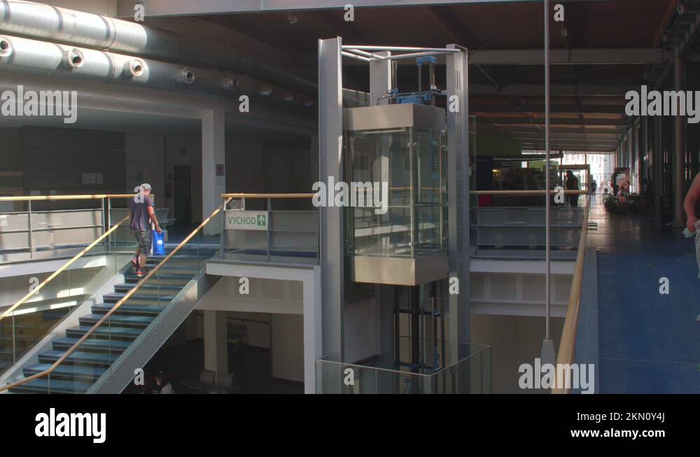 A staircase in a large room. Moving a person between levels. Glass ...