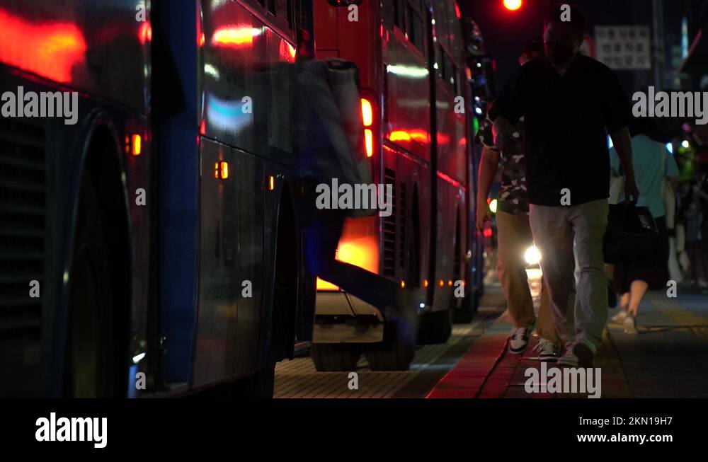 Passengers boarding a bus at the Gangnam, Seoul South Korea bus station ...
