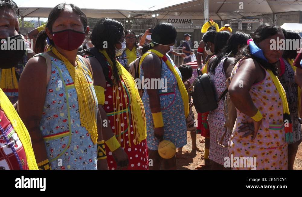 Women of the Amazon rain forest wear face masks and traditional ...