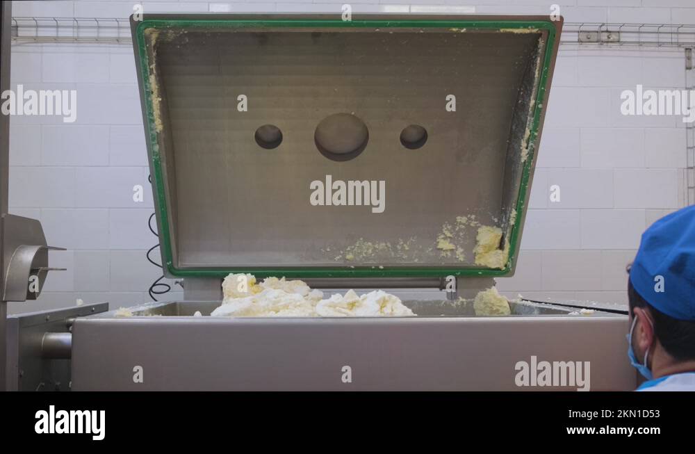 Filling the mixing machine with curd in a dairy plant Stock Video ...