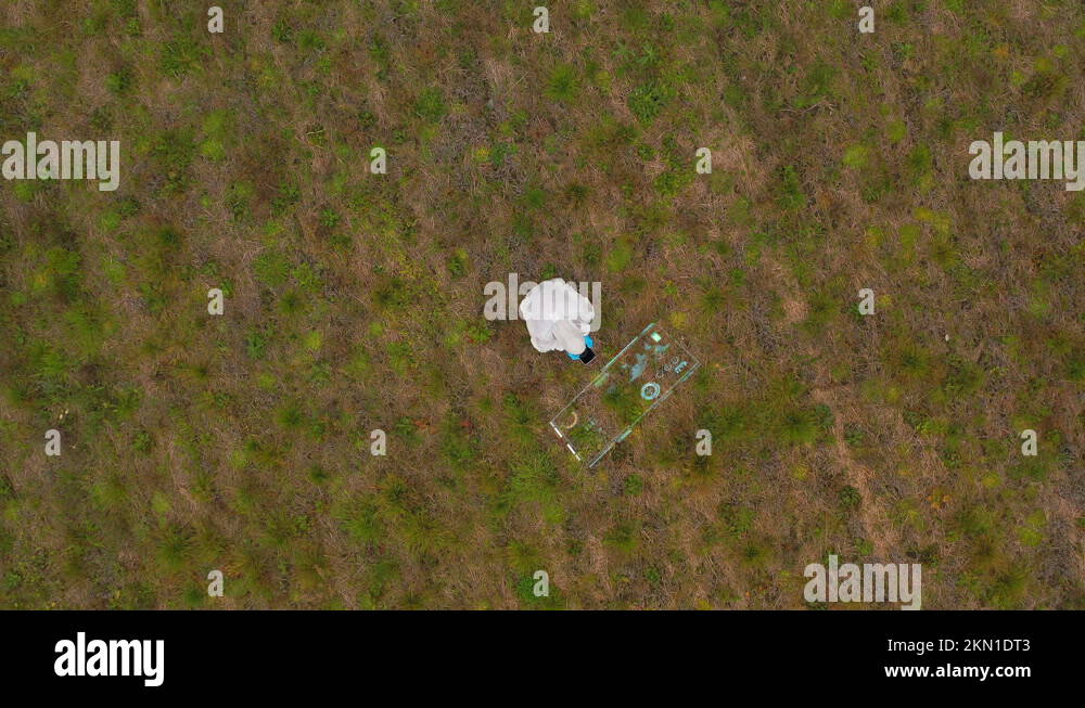 Biologist in a coverall inspecting soil contamination - 3d animation ...