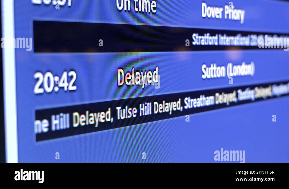 Train timetable board showing delayed trains at St Pancras ...