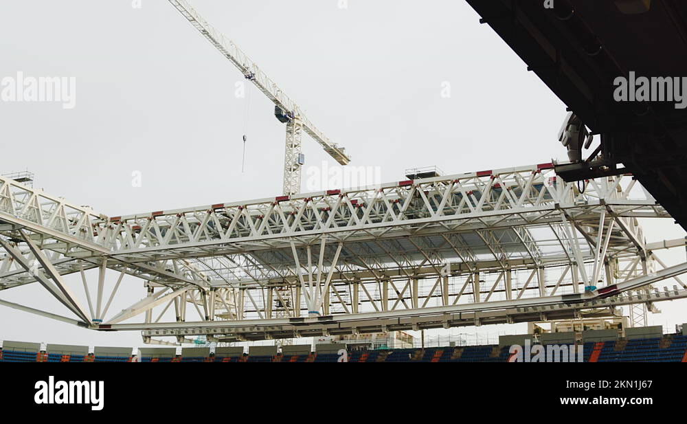 Tower Crane Working On Roof Structure Of A Football Stadium Being Stock ...