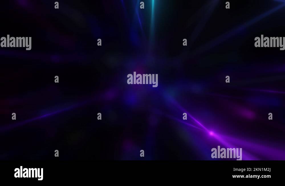 Blurry light spots deep in the black screen emit bright rainbow rays ...