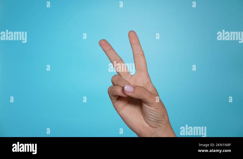 Woman 2 fingers up Stock Videos & Footage - HD and 4K Video Clips - Alamy