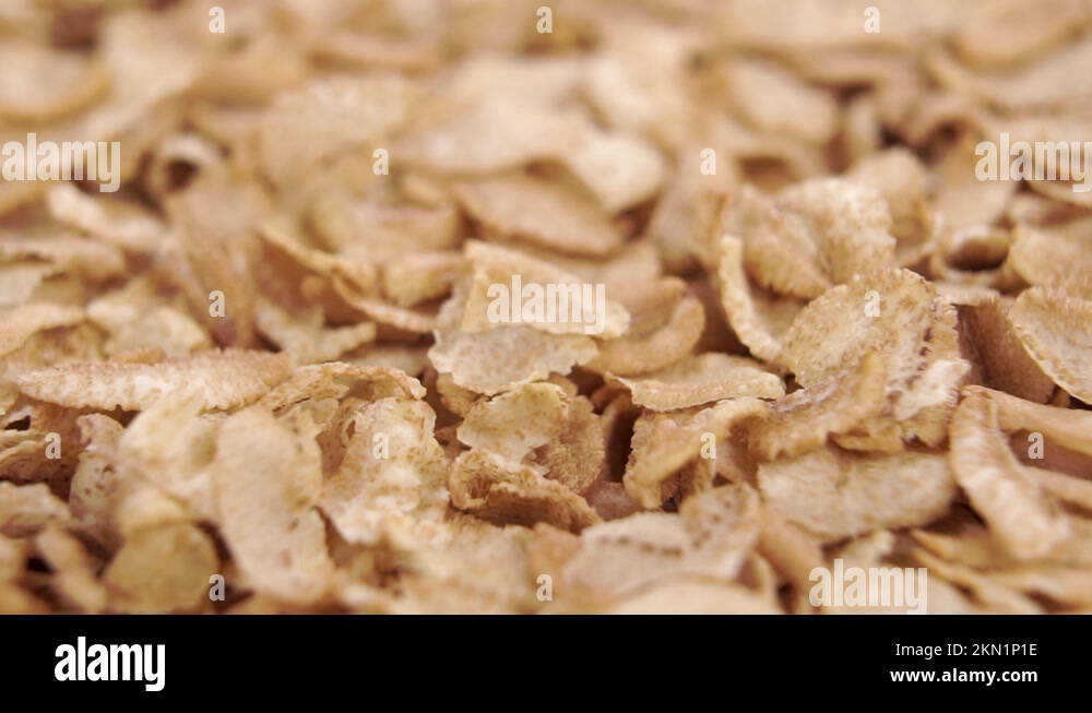 Wheat spelt flakes. Dry cereal healthy breakfast. Falling in slow ...