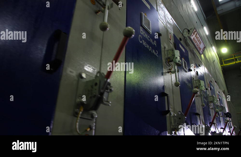 Motion past cabinets with levers in control room of plant Stock Video ...