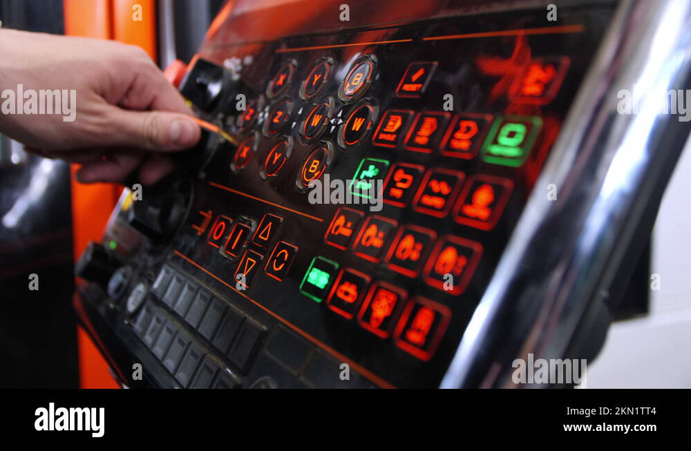 Employee turns handles on control panel tuning machine tool Stock Video ...