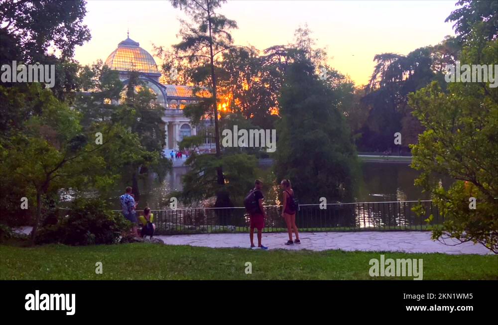 Young foreign couple walking peacefully through Retiro´s park in Madrid ...