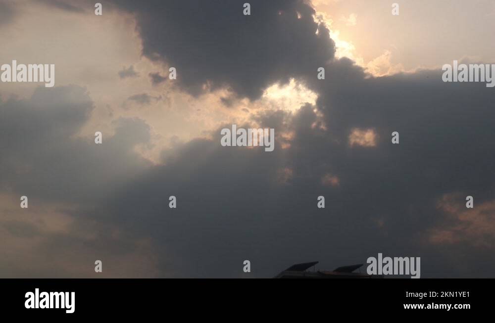 Sunlight falling on solar panel, sun peeking through clouds: low angle ...