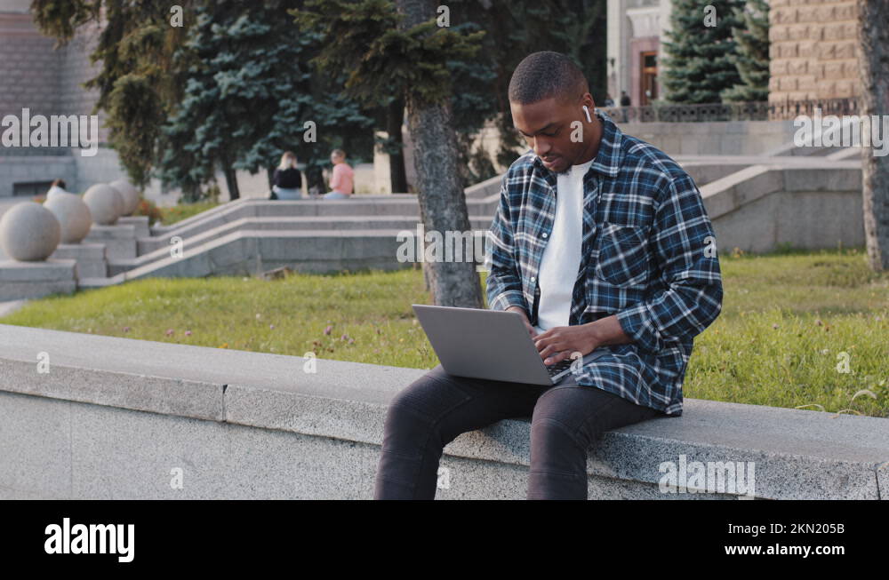 Successful busy african young man afro guy student male freelancer ...