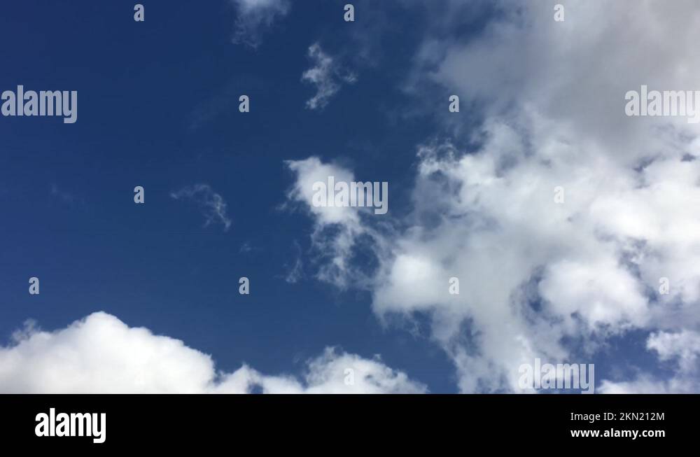 Slowly moving white cirrus cloud turn to angel and wing formation in ...