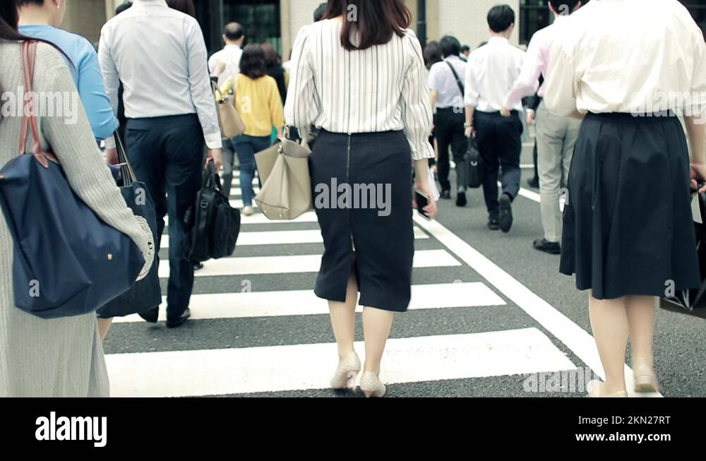 A crowd of a businessmen heading to work in the morning Stock Video ...