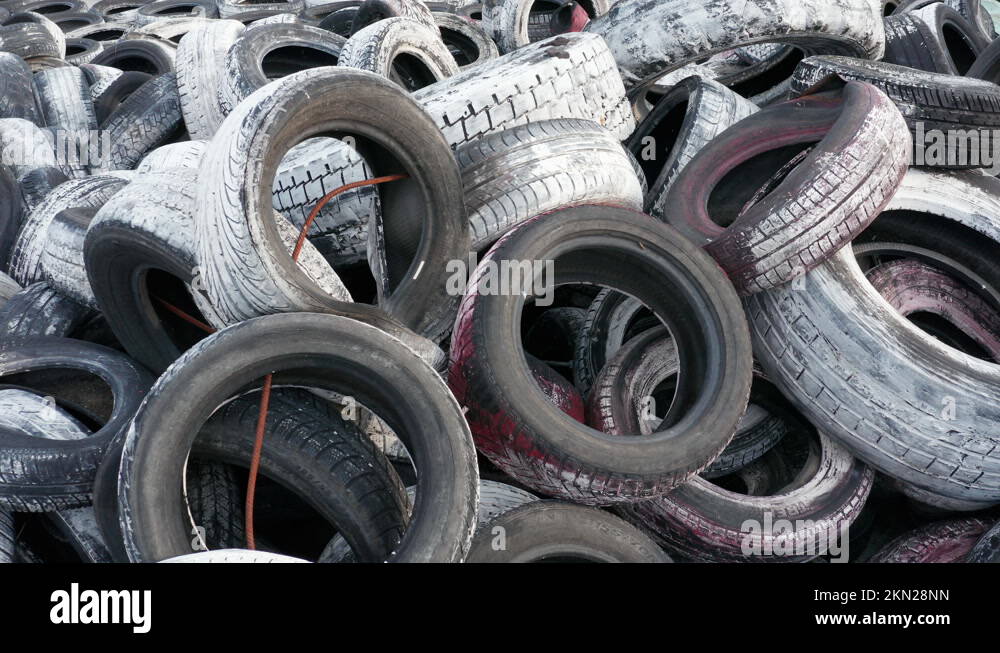 Pile of waste tires, dumped and ready for recycling. Heap of old scrap tyres Stock Video Footage ...