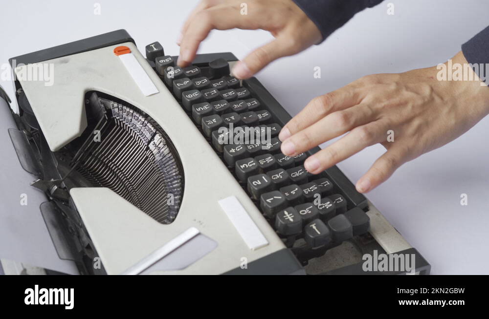 People hands typing an old Thai traditional typewriter. Classic vintage ...