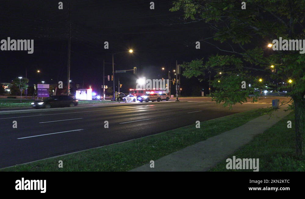 Car accident and crash at night in city intersection with emergency ...