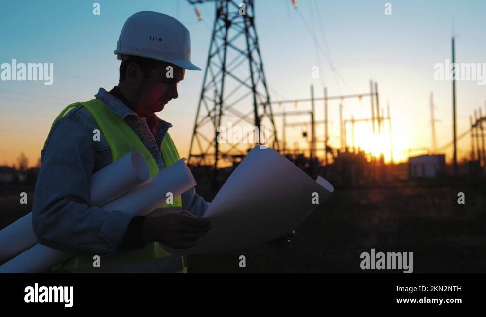Architect Worker Checking Construction Project On Electric Tower. One ...