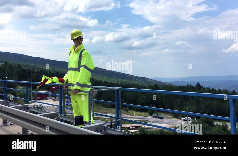Road sign in the shape of plastic man mannequin in bright uniform ...