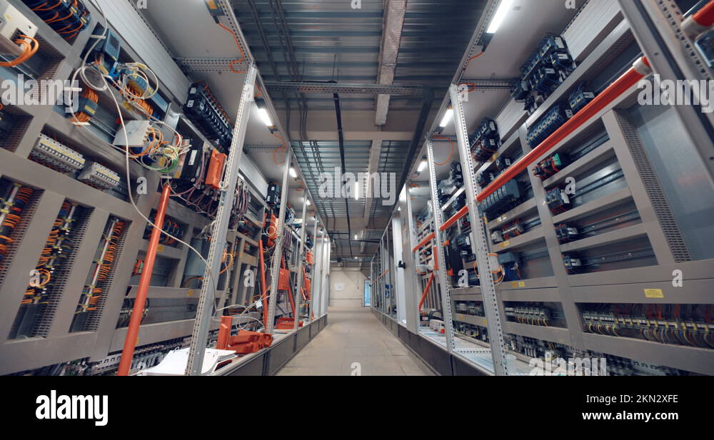 Industrial equipment control room corridor with many wires, electrical ...