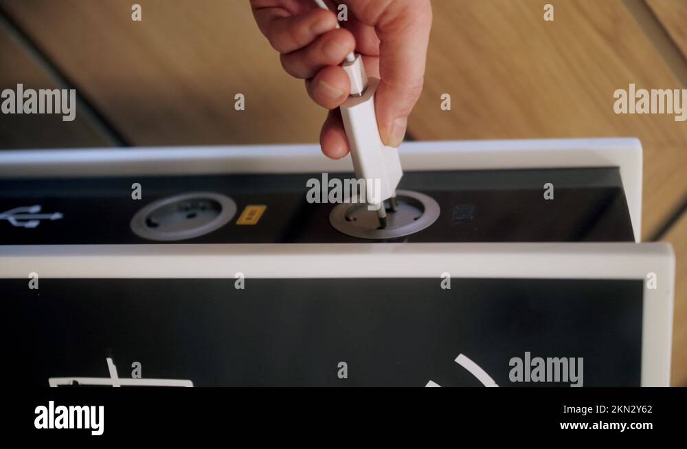 Charging station in public space. Charging the gadget in a special ...