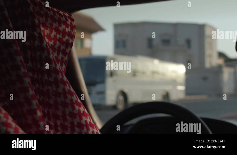 Saudi man inside the car, driving around the city wearing the ...