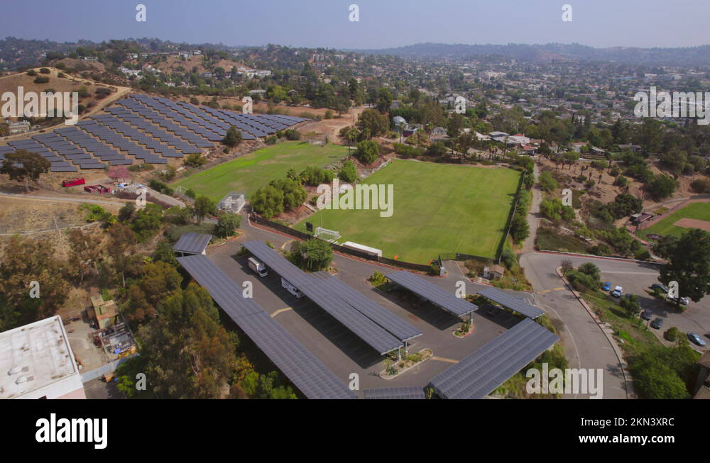 Pull away from solar panels and soccer field on a college campus in Los ...