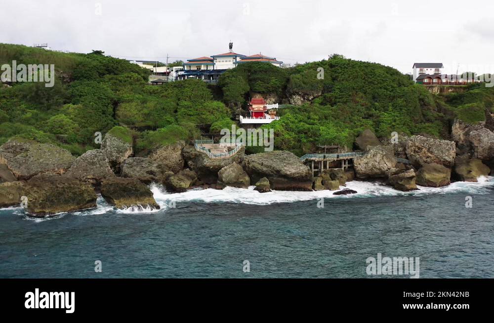 Cinematic aerial dolly out shot away from sea god temple at black dwarf ...