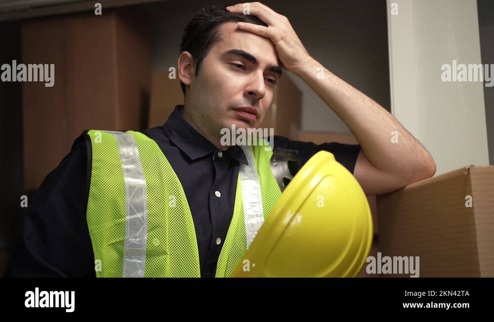 Sad and Depressed Looking Worker at Work in a Warehouse Stock Video ...