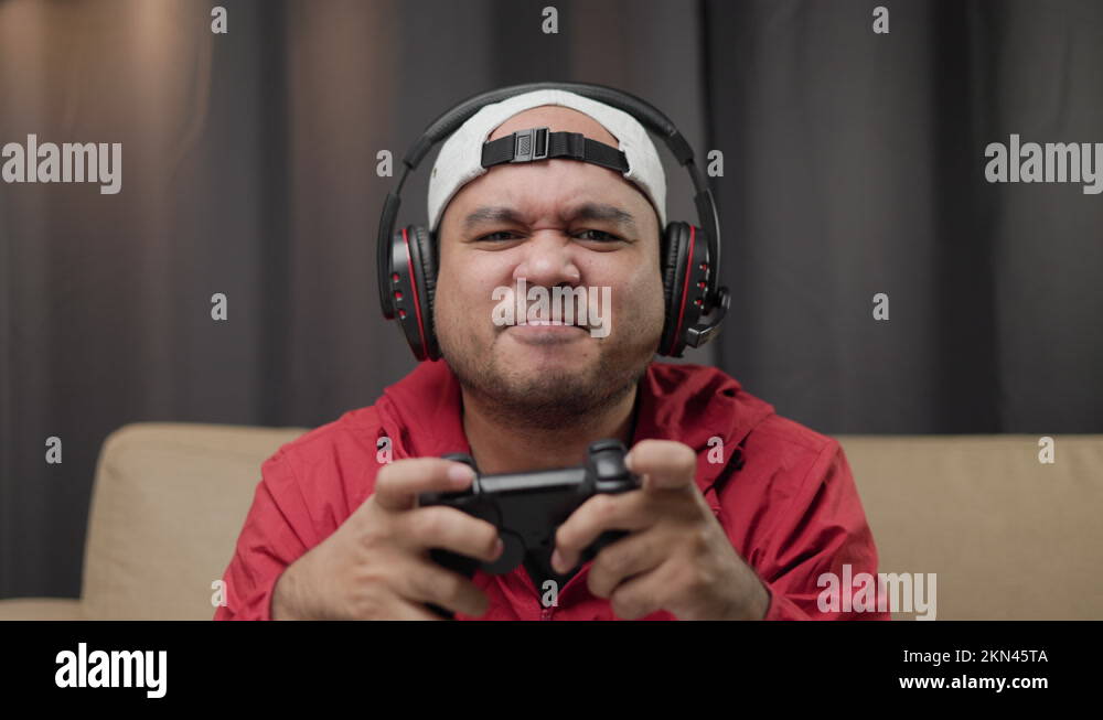 Angry asian gamer man. He lose in the game. Missed the chance to become ...