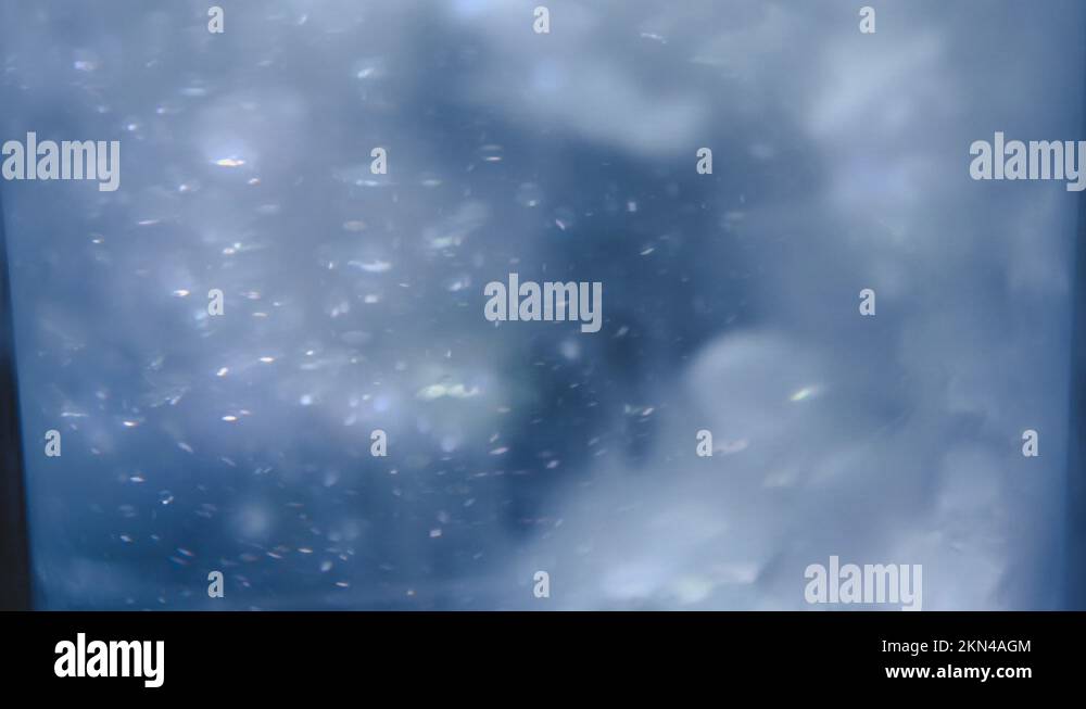 Close up motion stacked ice cubes collapsing with bubbles underwater ...
