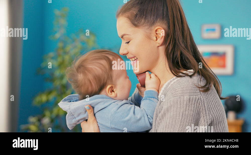 Women holding baby in arms Stock Videos & Footage - HD and 4K Video Clips - Alamy