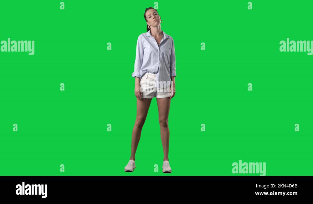 Sad or tired young stylish woman exhausted. Full body on green screen ...