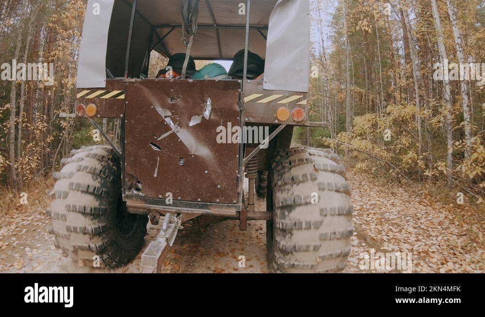 The all-terrain vehicle is driving along a forest road Stock Video ...