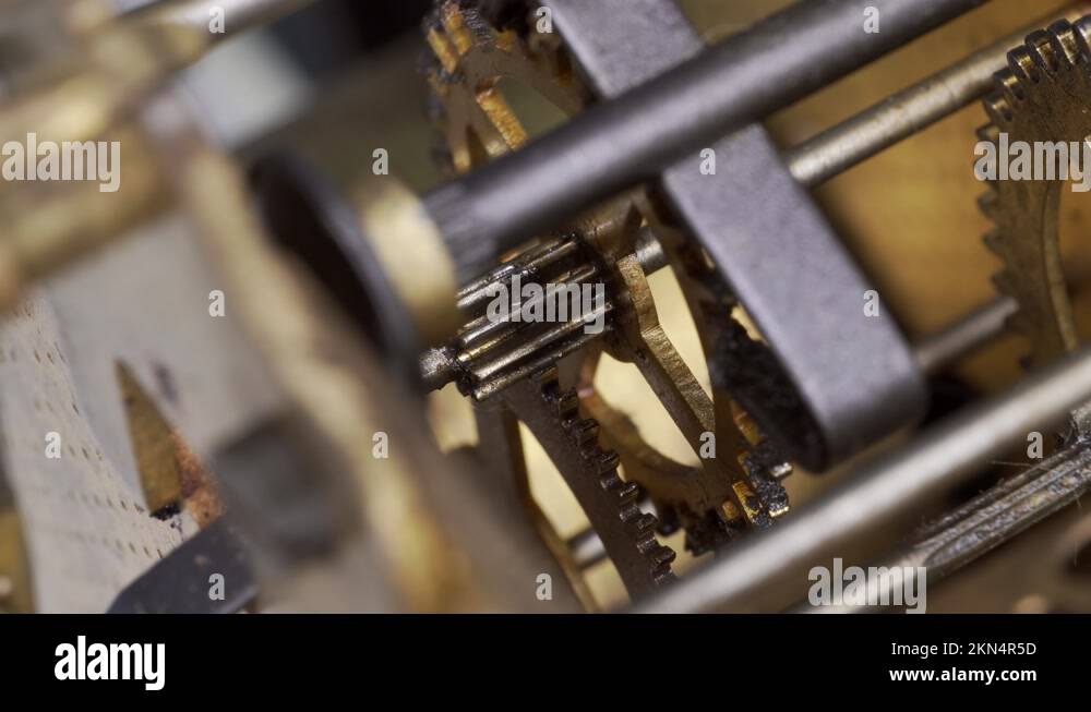 Cogwheels working inside a vintage clock. Internal clock mechanism ...