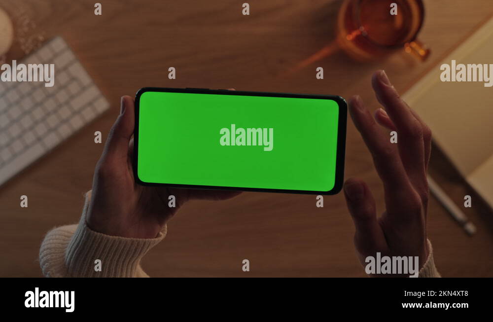 Female hands scrolling and tapping on mobile green screen Stock Video ...