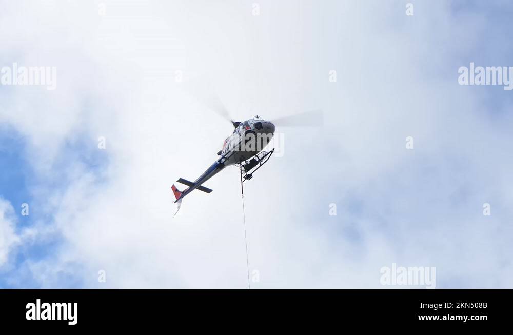 Eurocopter AS 350B-3 helicopter comes down with a sling load Stock ...