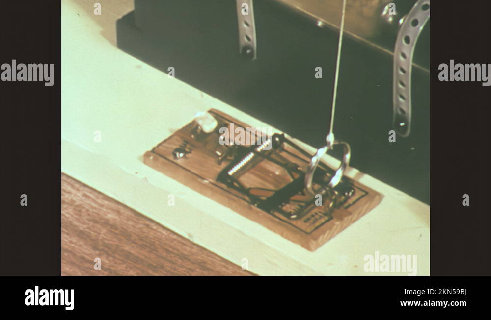1970s: UNITED STATES: close up of candle and wick. Mouse trap and ...